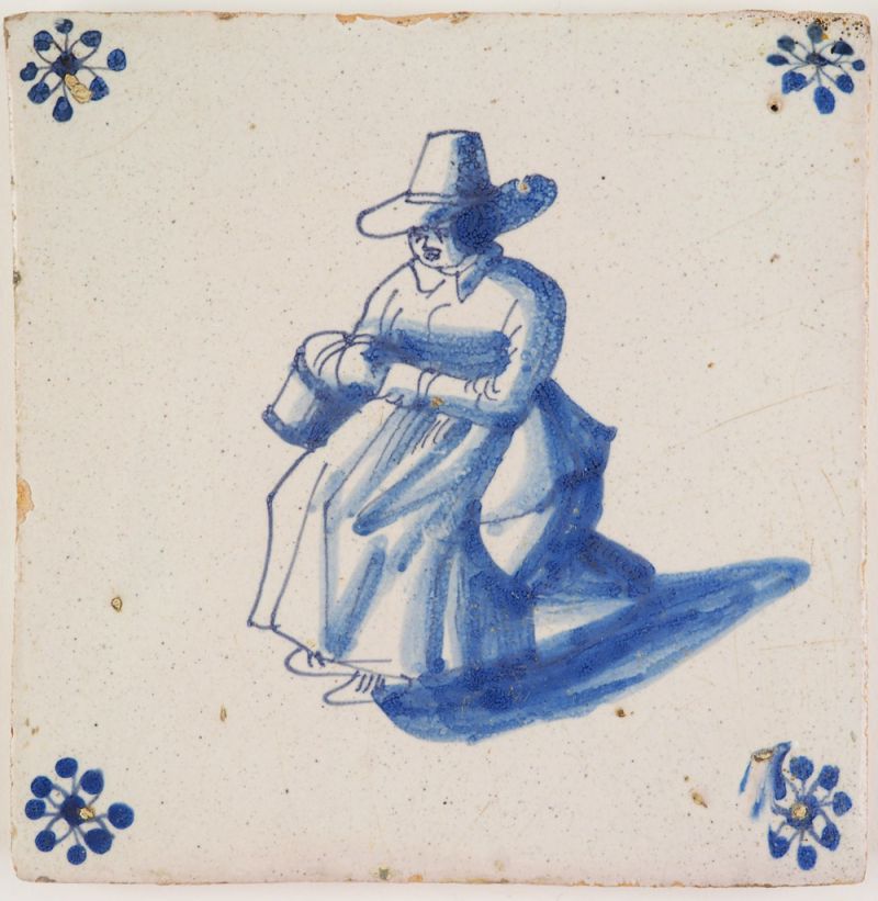 Antique Delft tile with a lady on a chair, 17th century