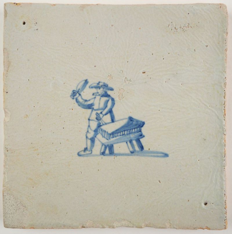 Antique Delft tile with a sculptor, 17th century