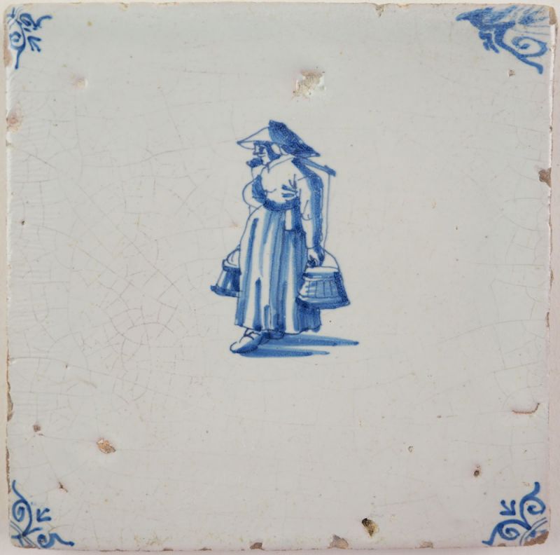 Antique Delft tile with a woman carrying a yoke, 17th century