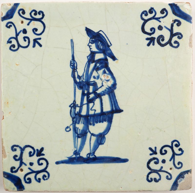 Antique Delft tile with a musketeer, 17th century