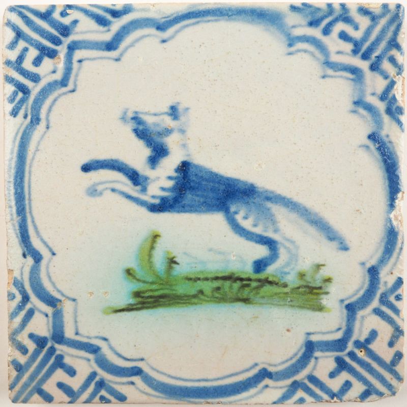 Antique Delft tile with a dog, 17th century