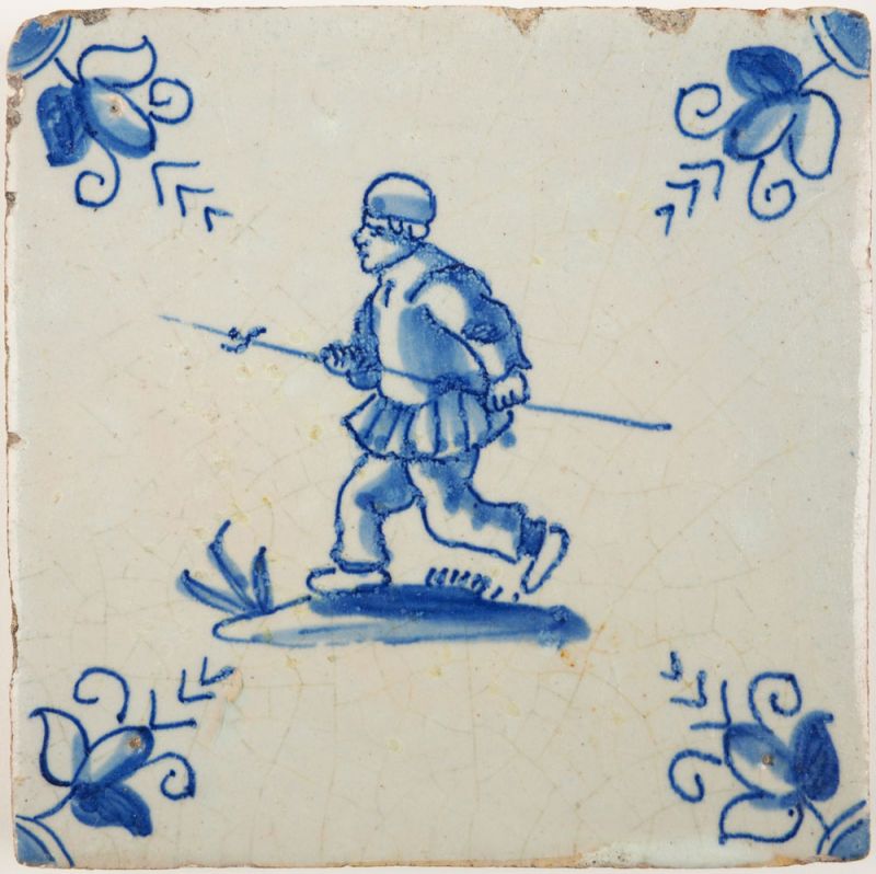 Antique Delft tile with a farmer, 17th century