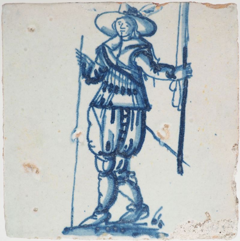 Antique Delft tile with a musketeer, 17th century