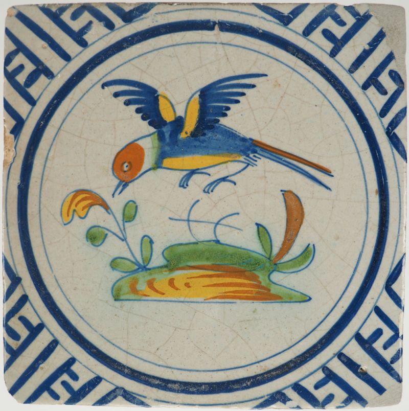 Antique polychrome Delft tile with a bird in flight, 17th century