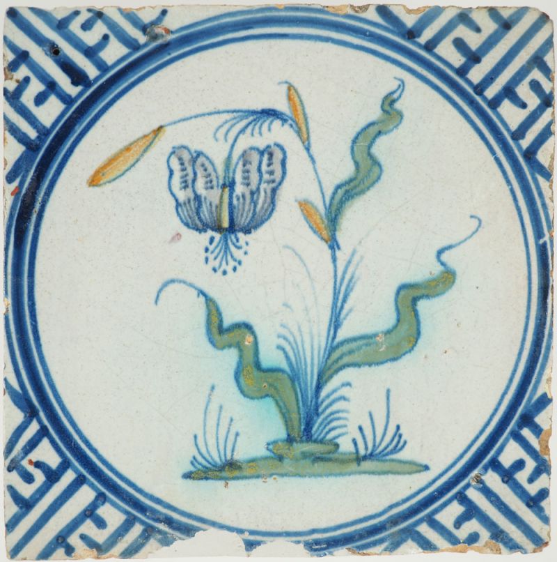 Antique Delft tile with a dog's tooth violet, 17th century