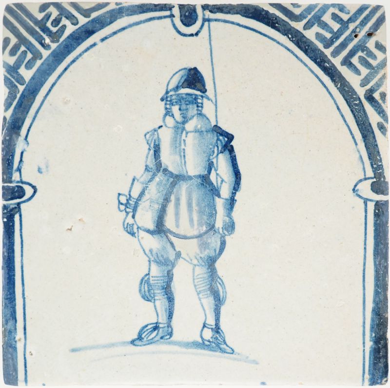 Antique Delft 'archway' tile with a soldier, 17th century