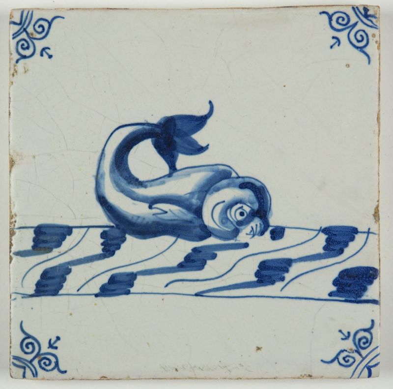 Antique Delft tile with a dolphin, 17th century