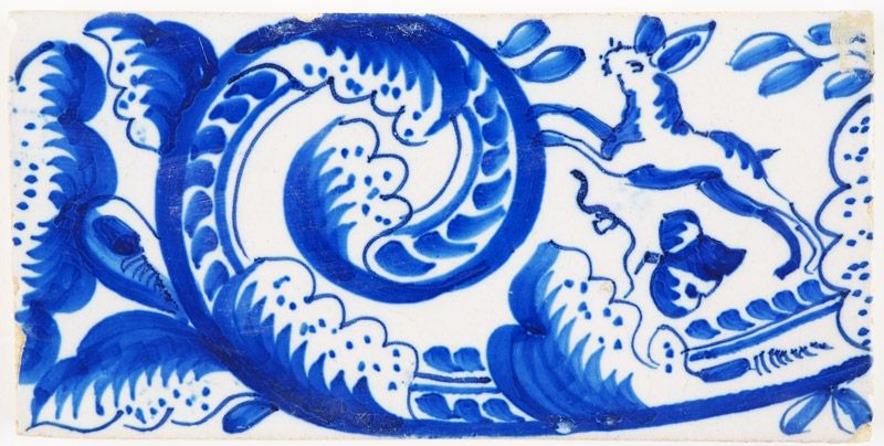 Antique Delft border tile with hares jumping through a garland of ...
