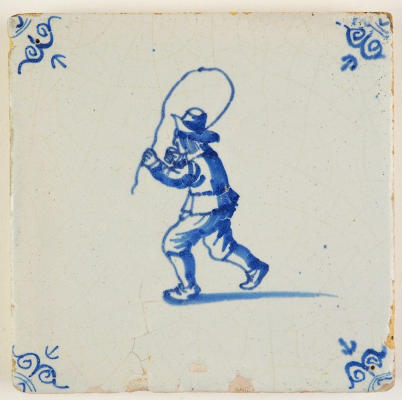 Antique Delft tile in blue with a child playing with a jumping rope ...