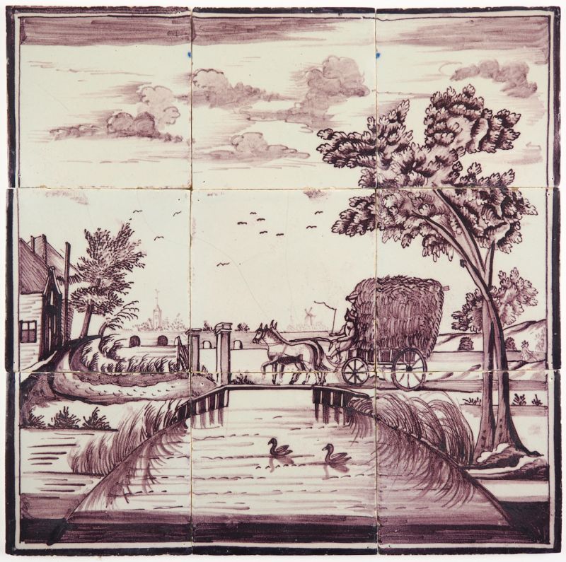 Antique Delft tile mural in manganese with a farmer brining in the hay ...