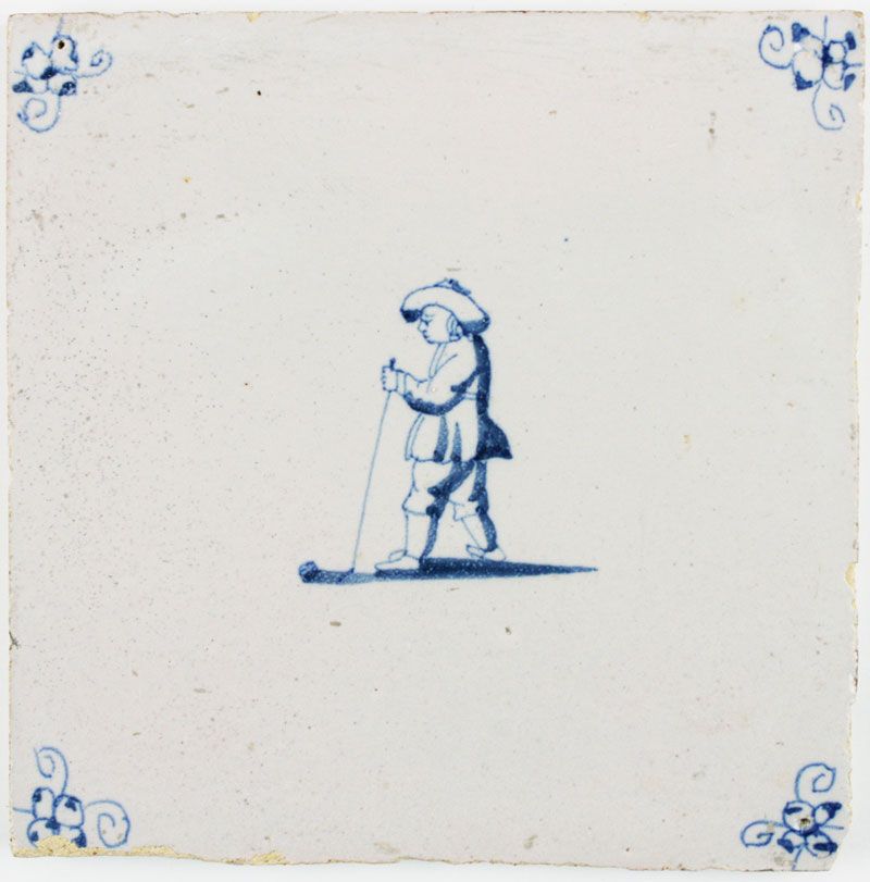 Antique Dutch tile with a child playing golf, 18th century