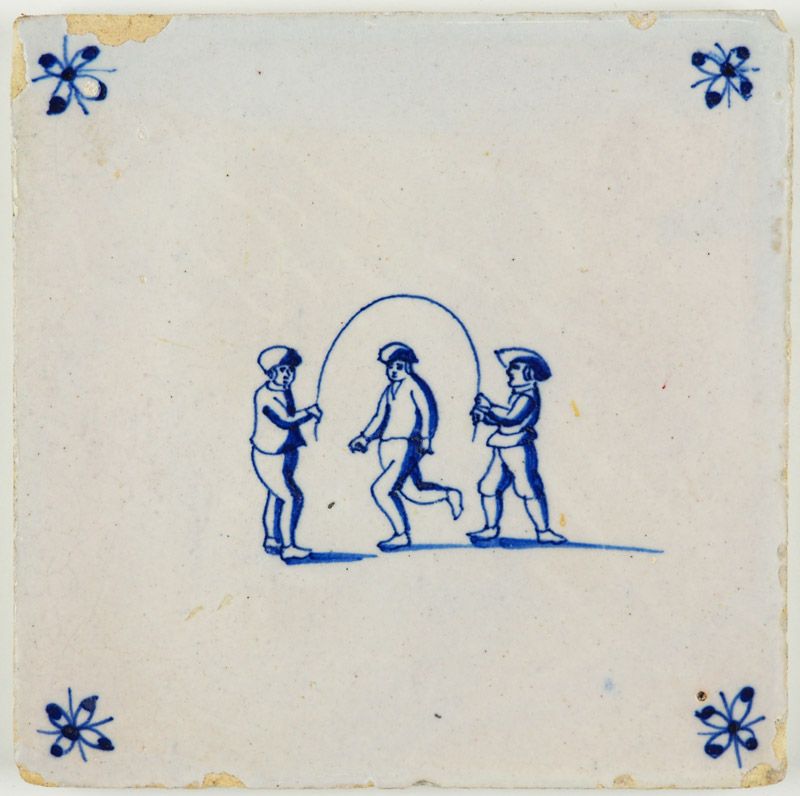 Antique Delft tile with three children playing with a jumping rope ...