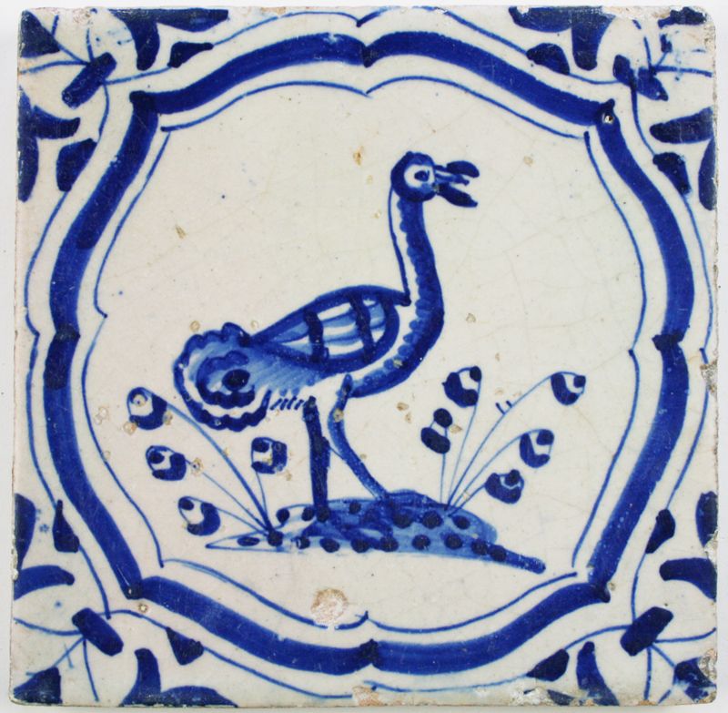 Antique Dutch Delft tile with an ostrich with a horseshoe in its beak ...