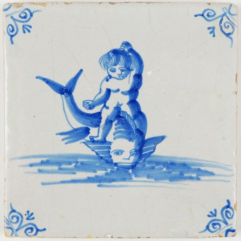 Antique Dutch Delft tile with putti on top of a dolphin with a human ...