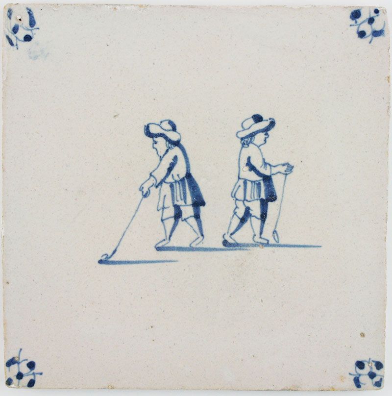 Antique Dutch Delft tile in blue with two children playing a game of ...